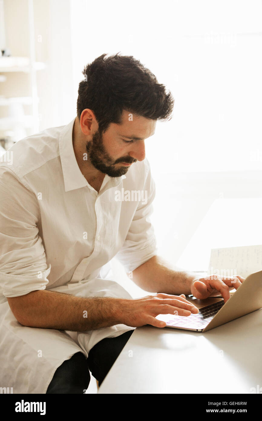 Baker wearing apron preparing hi-res stock photography and images - Alamy