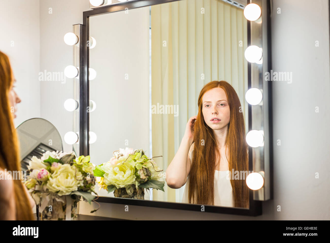 Head and Shoulders of Attractive Young Woman with Red Hair Admiring ...