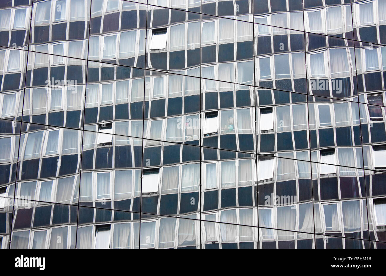 Building from the 60's reflected in the opposite one from the '90's ...