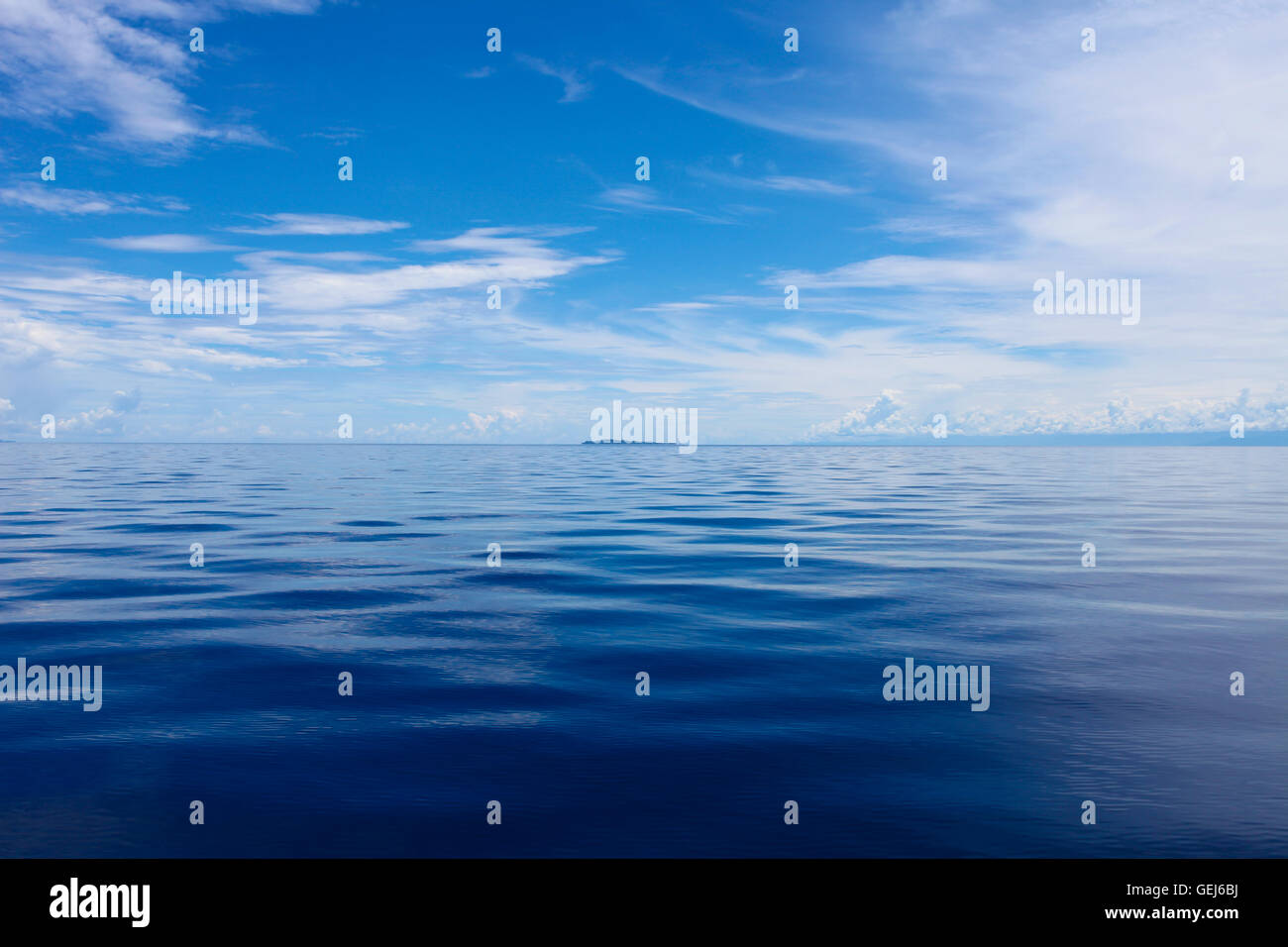 Photo of Blue Sea and Tropical Sky Clouds. Seascape. Sun over Water ...