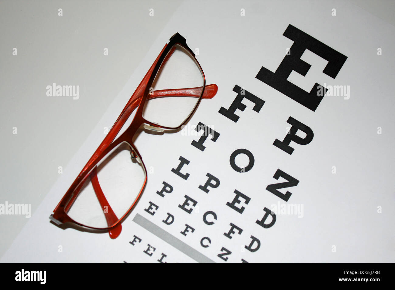 Reading - eyeglasses and eye chart close-up on a light background Stock ...