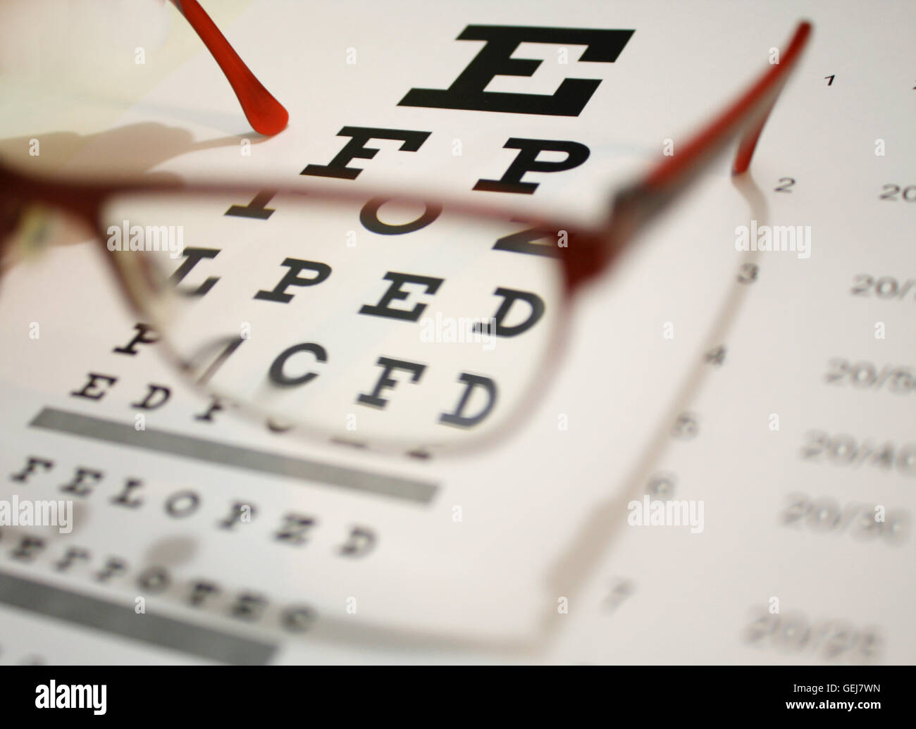 eyeglasses and eye chart close-up on a light background Stock Photo - Alamy