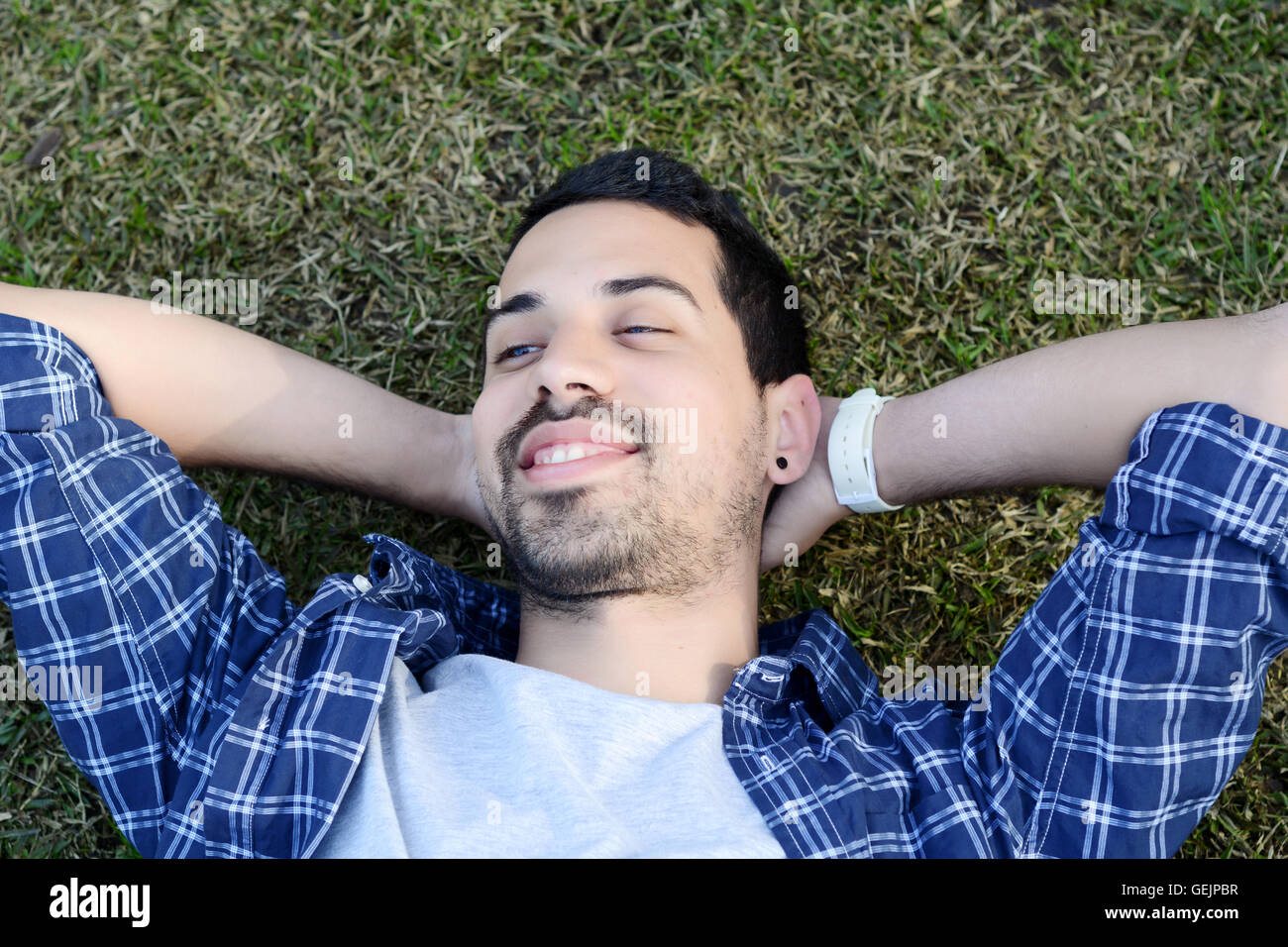 Young latin man lying on hi-res stock photography and images - Alamy