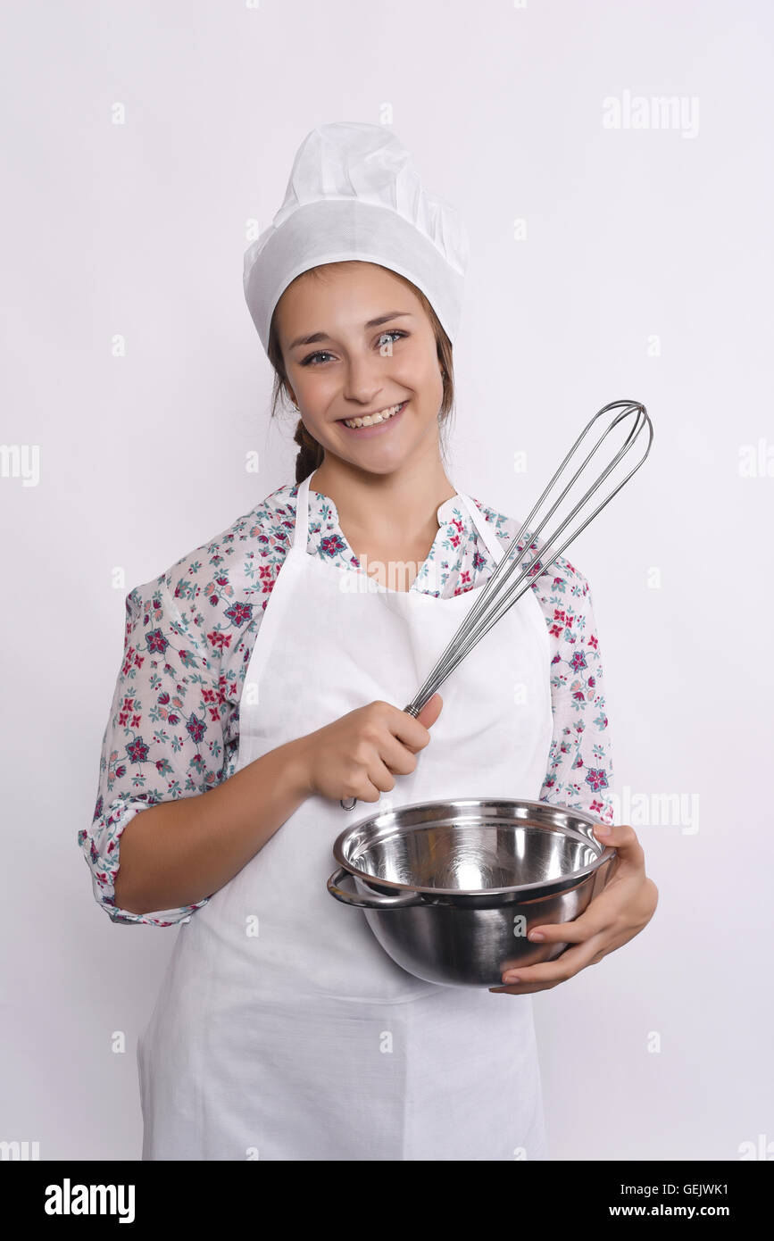 Young beautiful woman cooking. Isolated white background Stock Photo ...