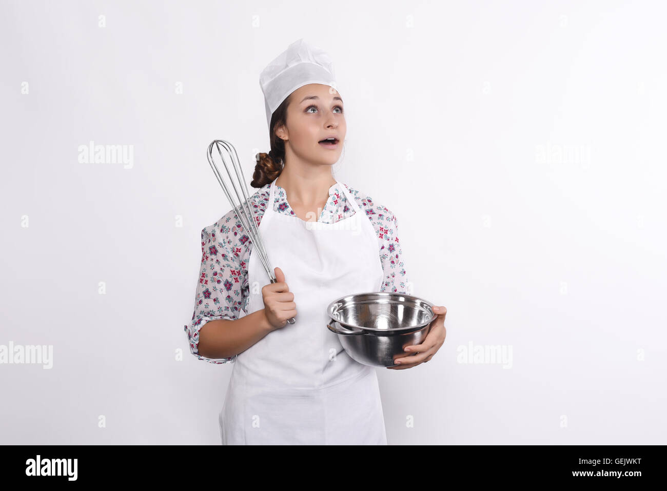 Young beautiful woman cooking. Isolated white background Stock Photo ...