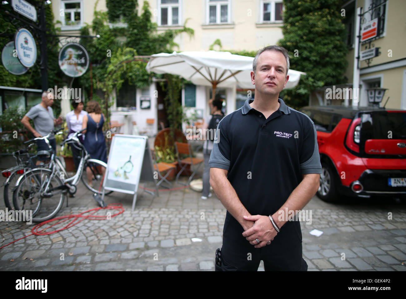 Ansbach, Germany. 26th July, 2016. Bodyguard Andreas Schmidt stands at ...
