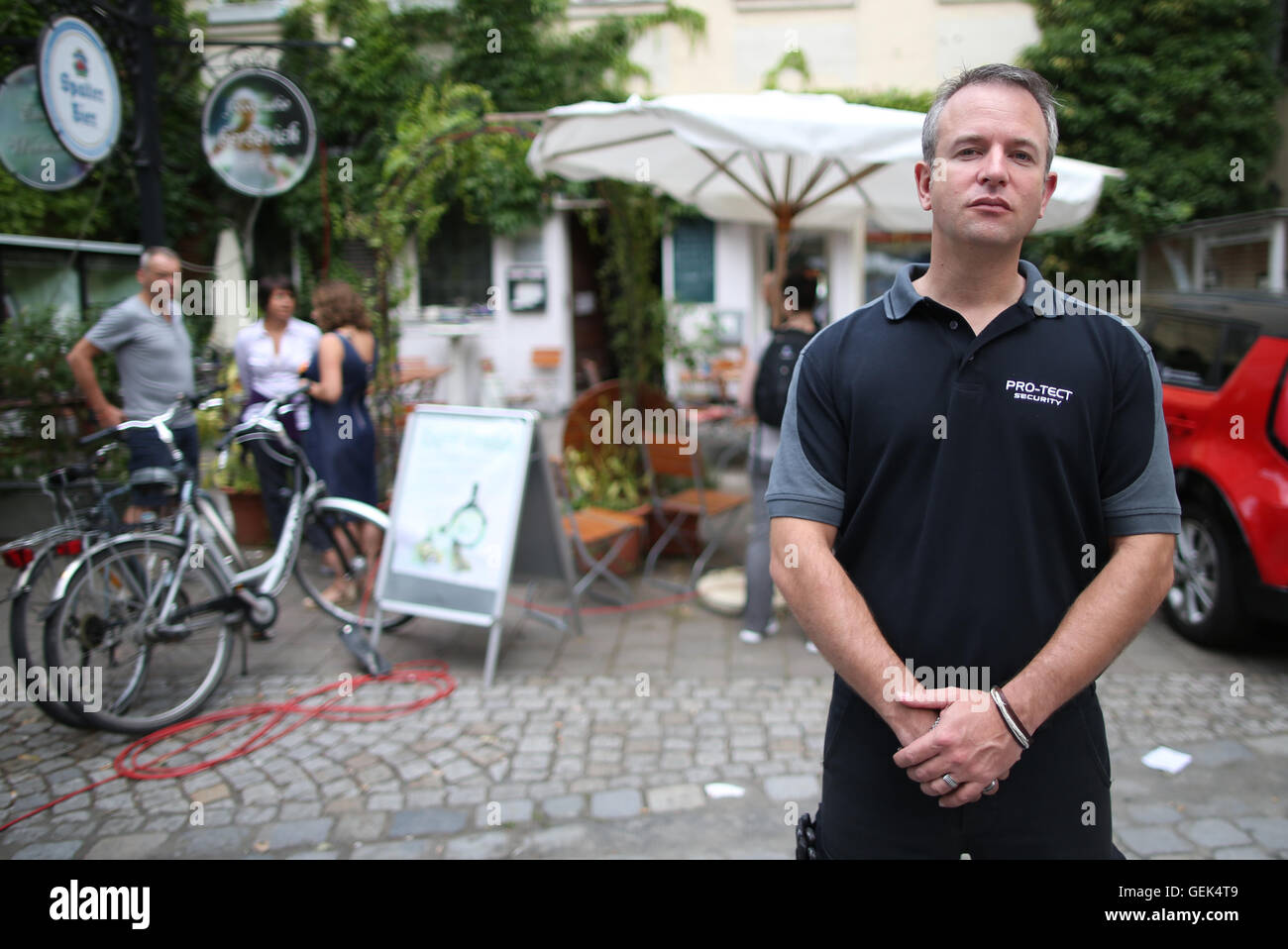 Ansbach, Germany. 26th July, 2016. Bodyguard Andreas Schmidt stands at ...