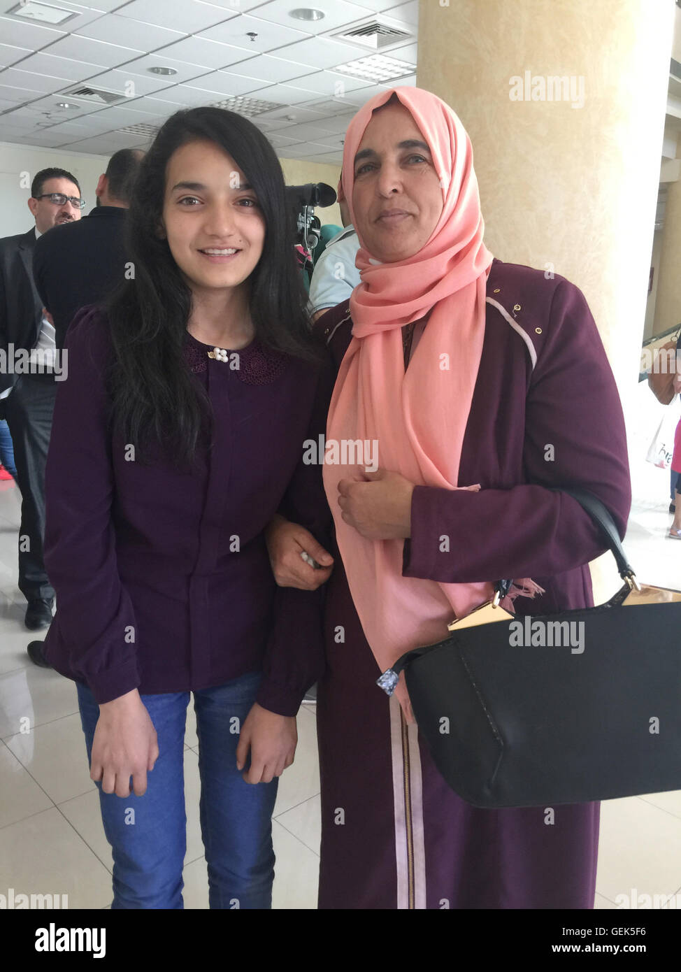 Dima al-Wawi, 12, poses with her mother, Sabha al-Wawi, 47 (R) in ...