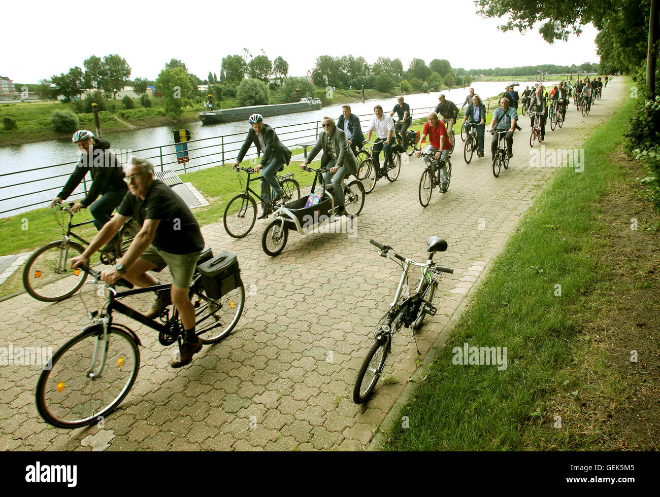 Duisburg, Germany. 15th July, 2016. A group of cyclists riding along ...
