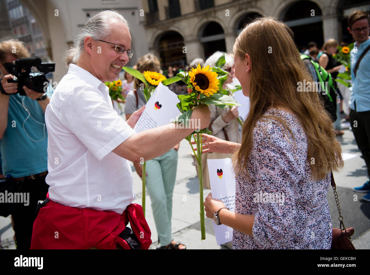 Handing out flowers hi-res stock photography and images - Alamy