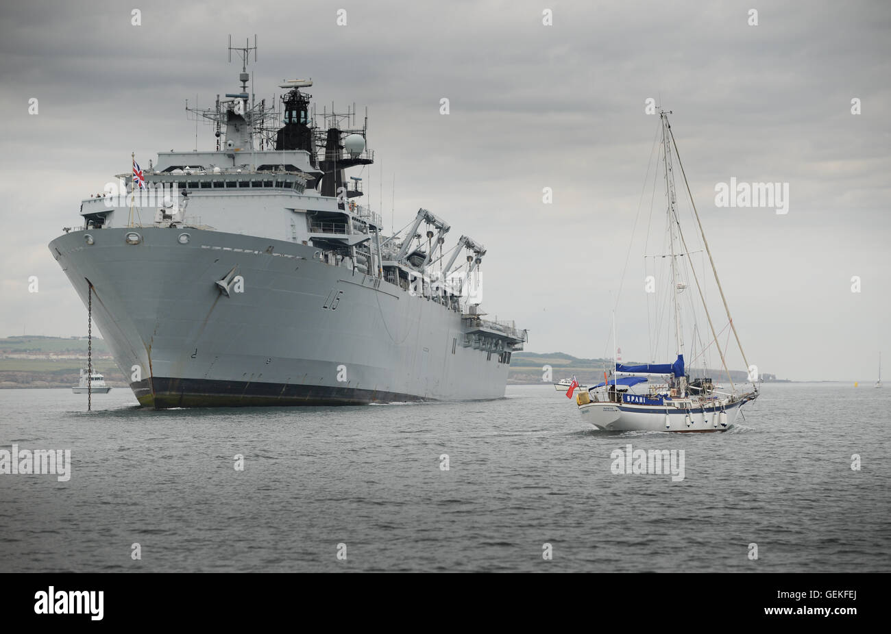 The Royal Navy 'Albion' class, assault ship HMS Bulwark with the yacht ...