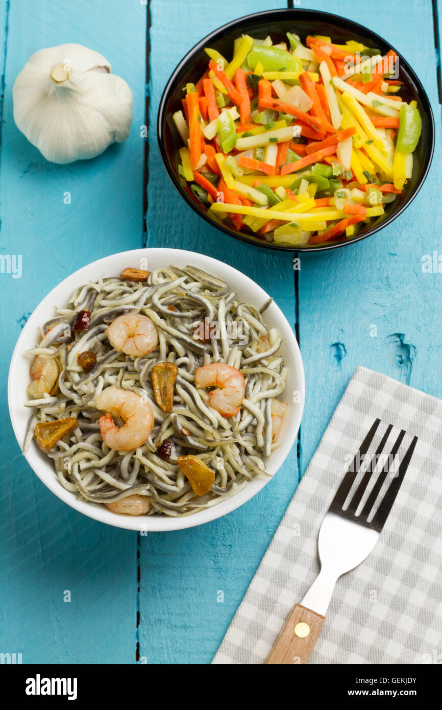Surimi elvers with prawns, garlic and pepper Stock Photo - Alamy