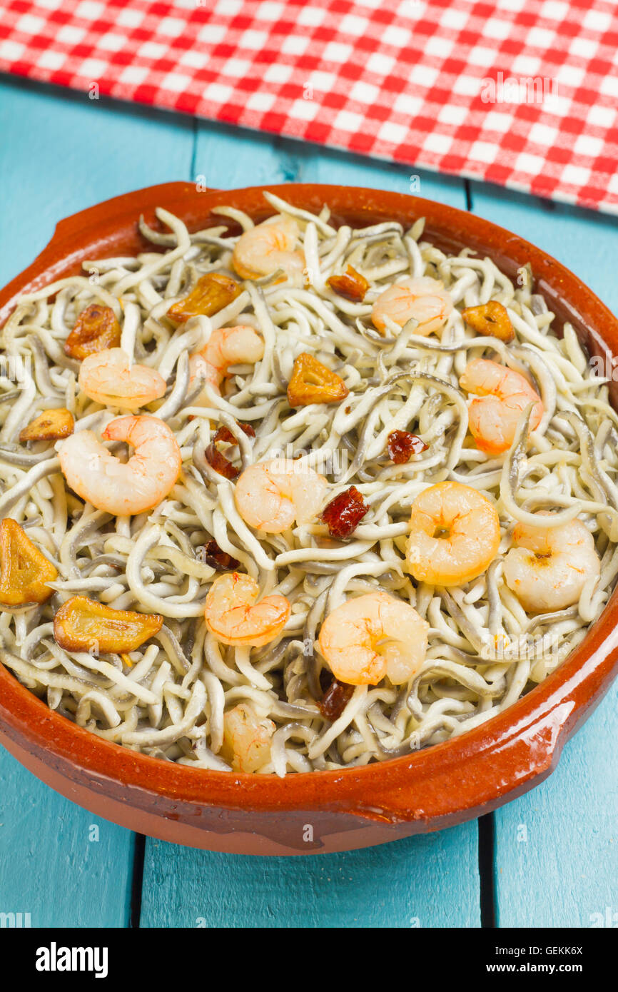 Surimi elvers with prawns, garlic and pepper in a traditional ...