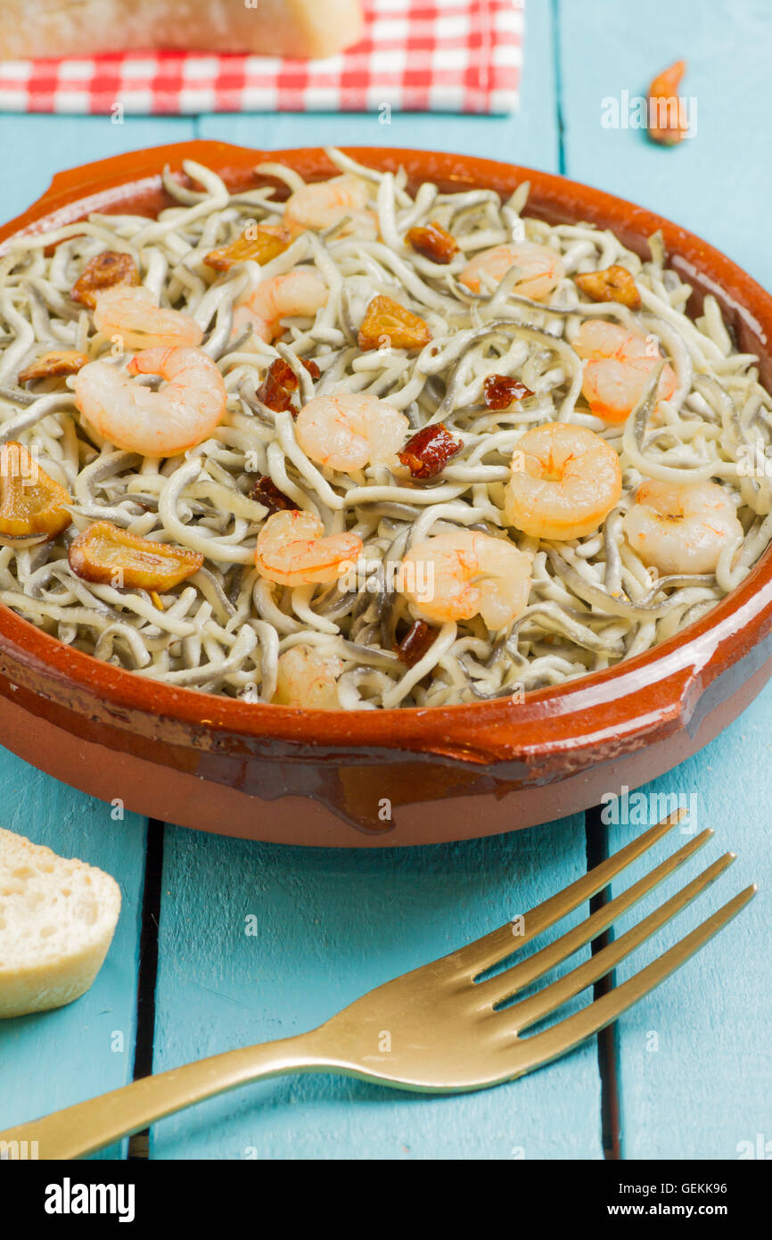 Surimi elvers with prawns, garlic and pepper in a traditional ...