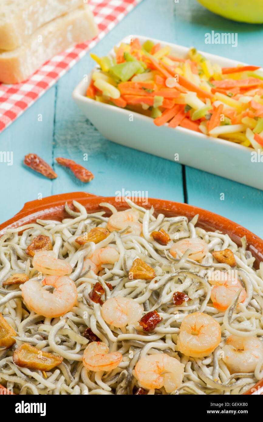 Surimi elvers with prawns, garlic and pepper in a traditional ...
