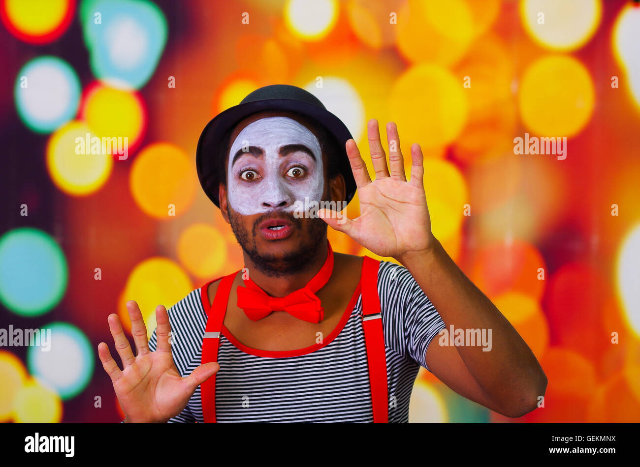 Pantomime man with facial paint posing for camera interacting funny ...