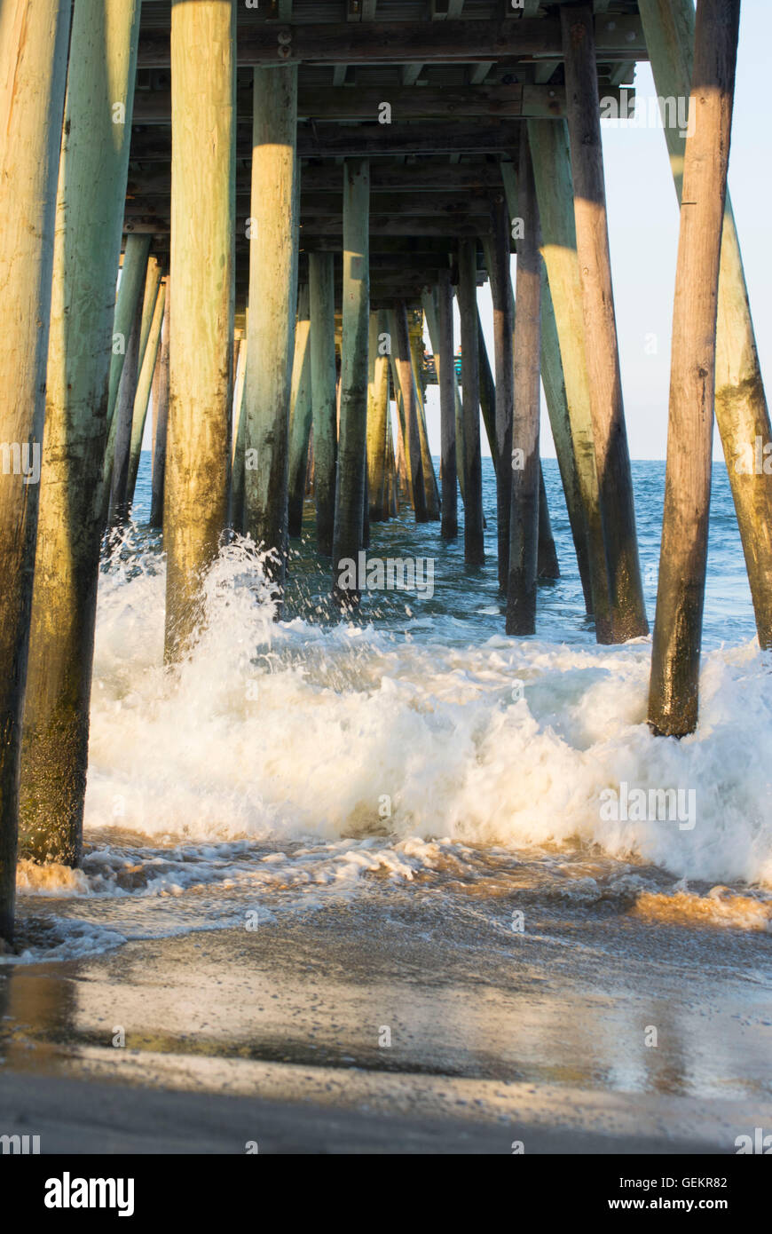 wild ocean under piers Stock Photo - Alamy