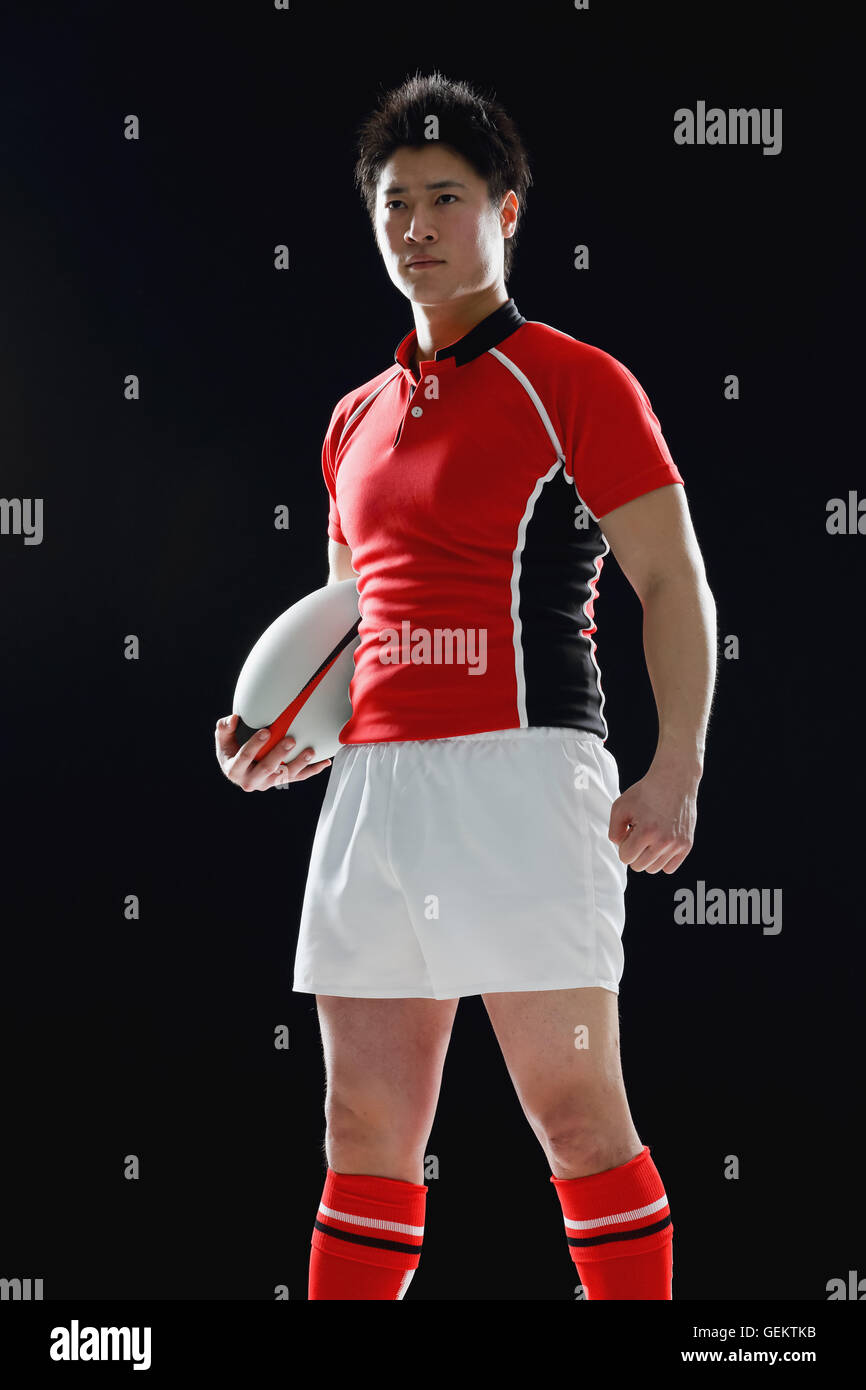 Portrait of Japanese rugby player with ball Stock Photo - Alamy