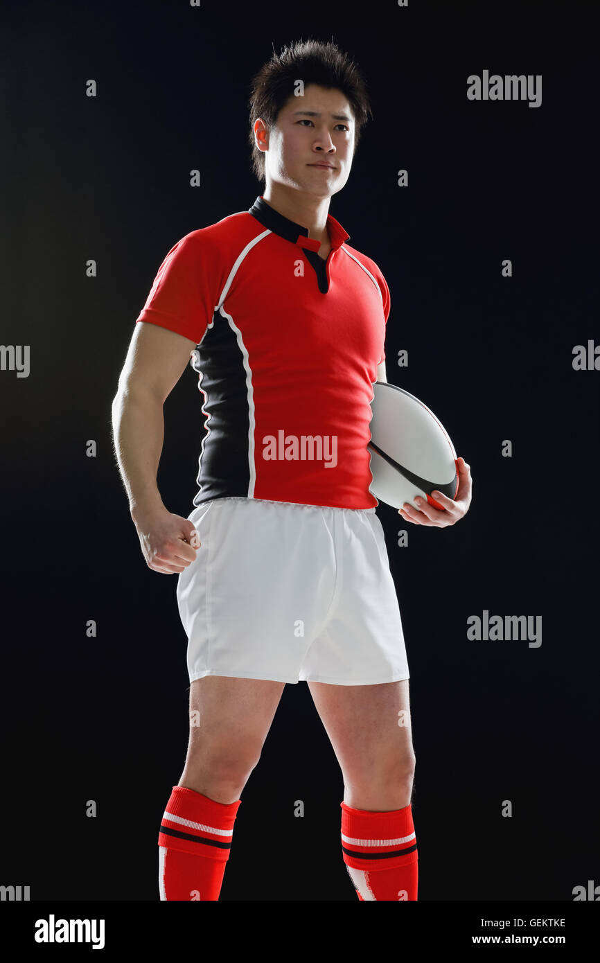 Portrait of Japanese rugby player with ball Stock Photo - Alamy