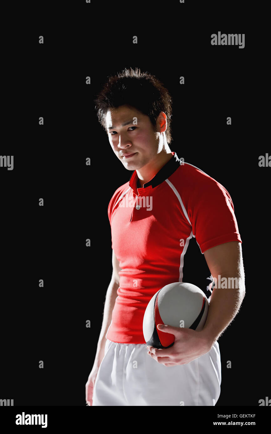 Portrait of Japanese rugby player with ball Stock Photo - Alamy