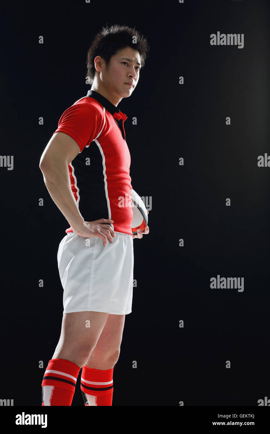 Portrait of Japanese rugby player with ball Stock Photo - Alamy
