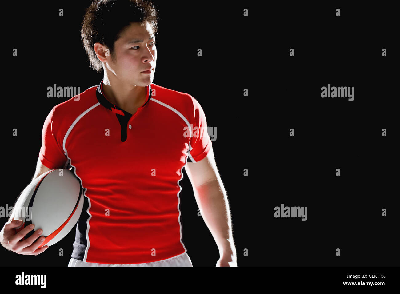 Portrait of Japanese rugby player with ball Stock Photo - Alamy