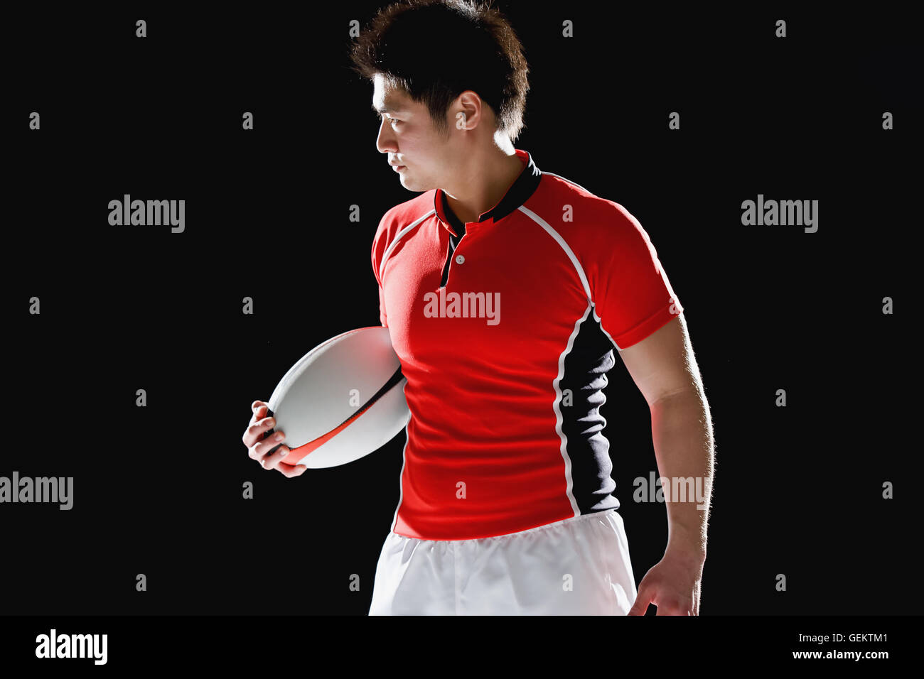 Portrait of Japanese rugby player with ball Stock Photo - Alamy
