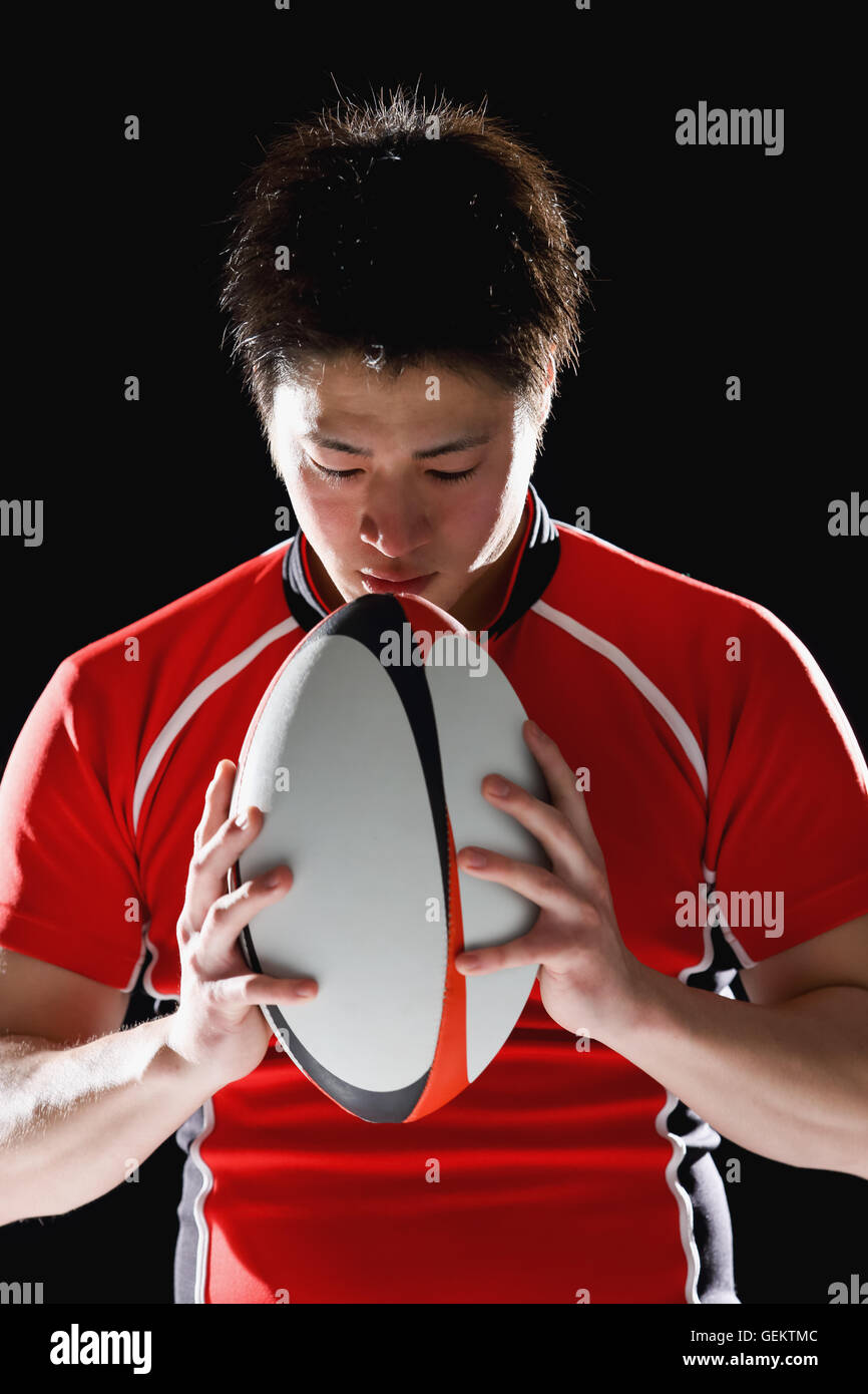 Portrait of Japanese rugby player with ball Stock Photo - Alamy