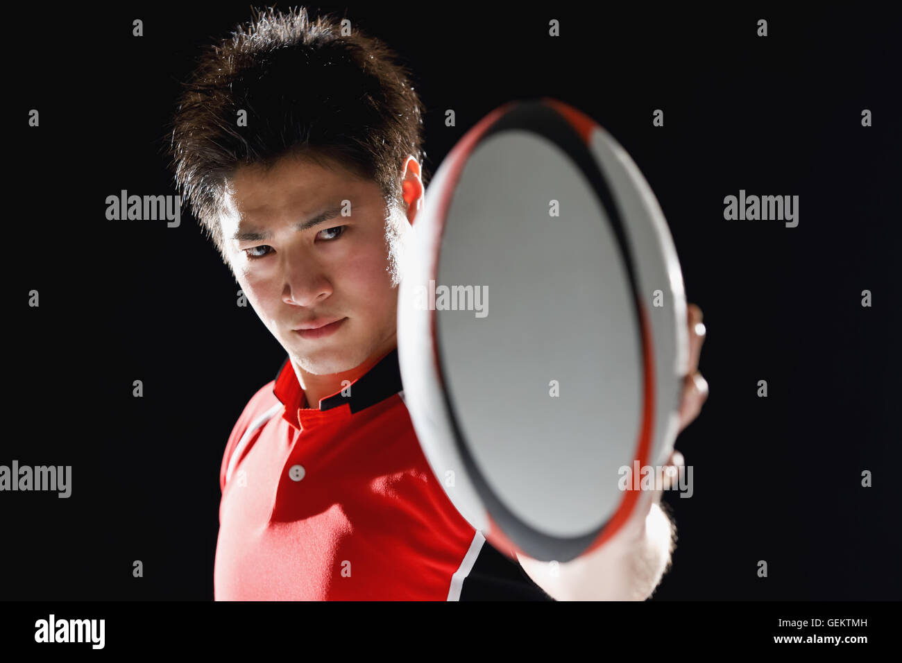 Portrait of Japanese rugby player with ball Stock Photo - Alamy