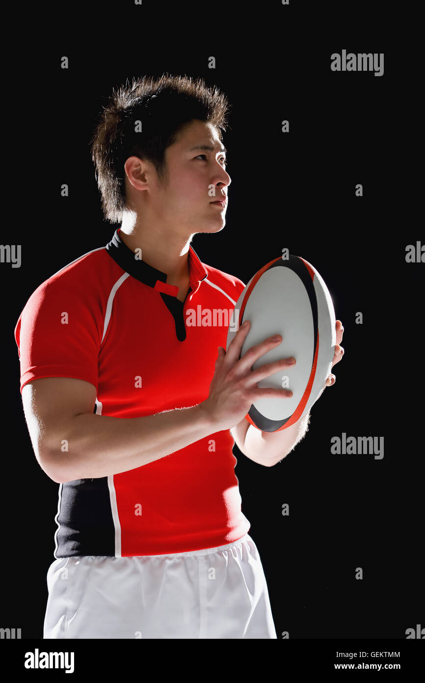 Portrait of Japanese rugby player with ball Stock Photo - Alamy