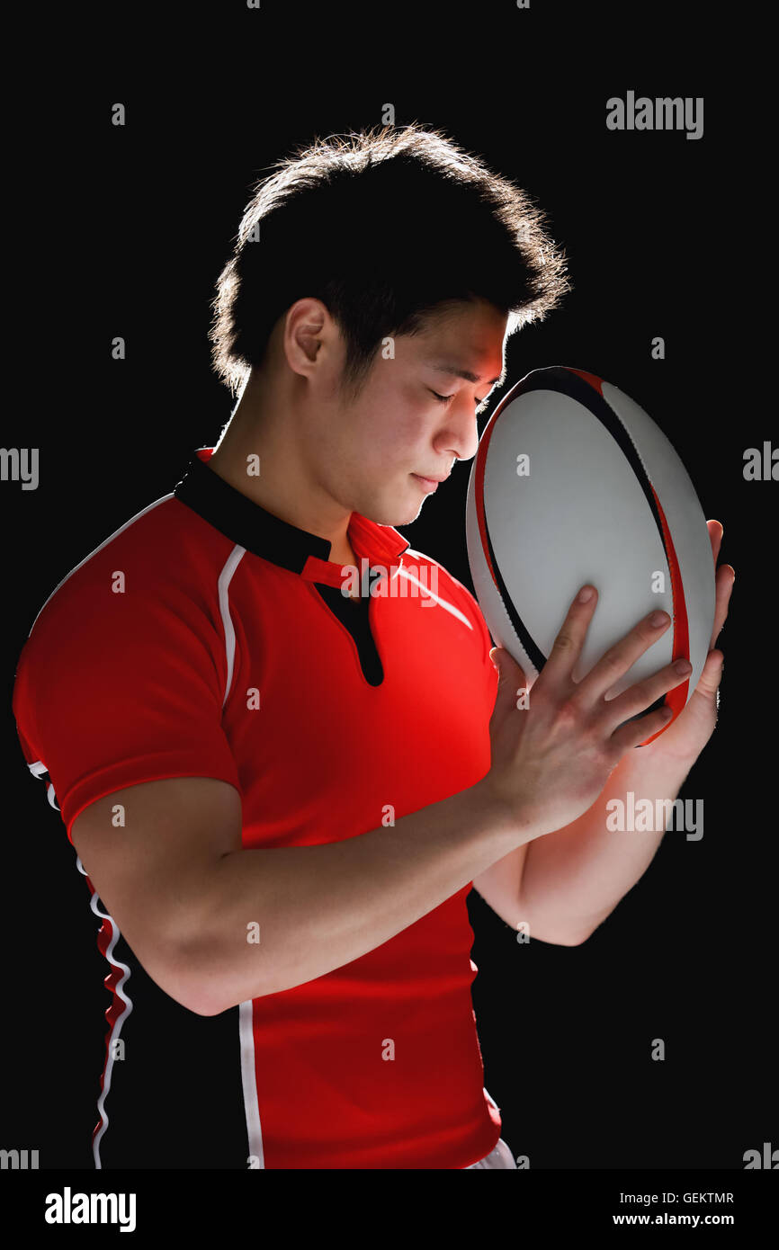 Portrait of Japanese rugby player with ball Stock Photo - Alamy