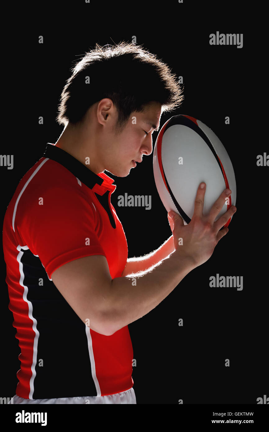 Portrait of Japanese rugby player with ball Stock Photo - Alamy