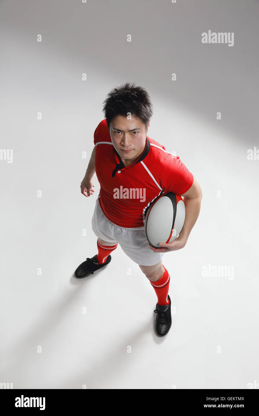Portrait of Japanese rugby player with ball Stock Photo - Alamy