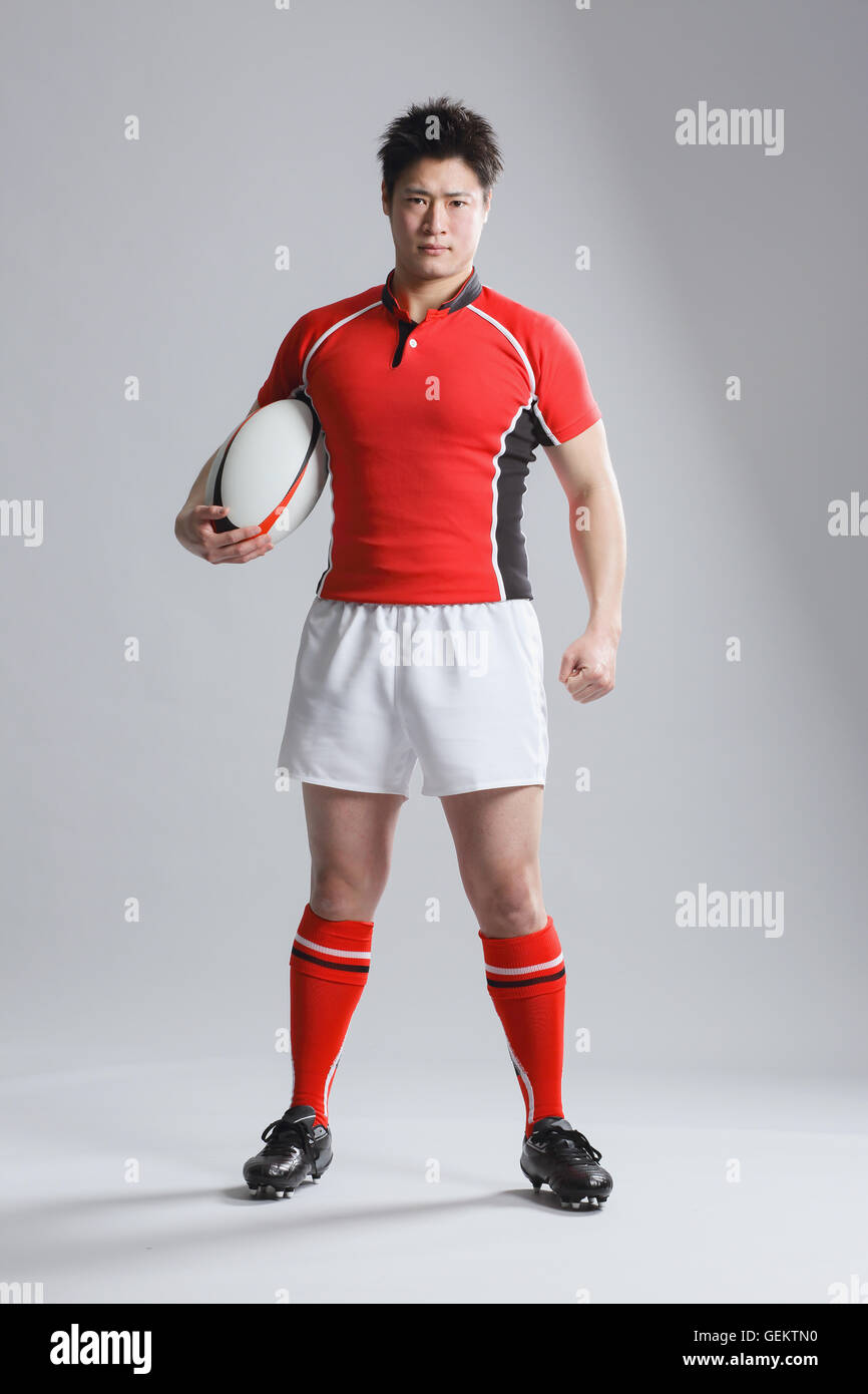 Portrait of Japanese rugby player with ball Stock Photo - Alamy
