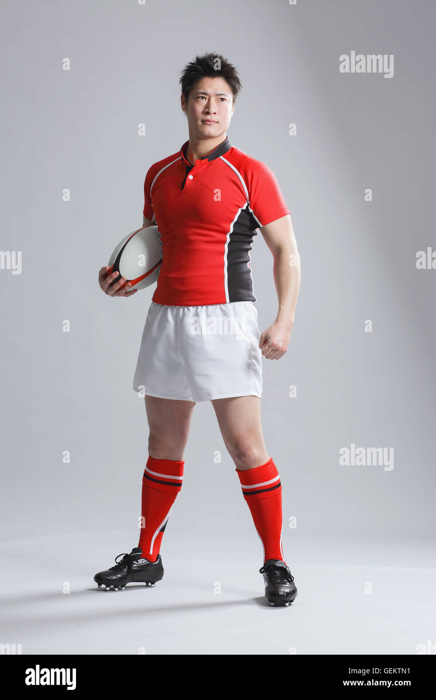 Portrait of Japanese rugby player with ball Stock Photo - Alamy