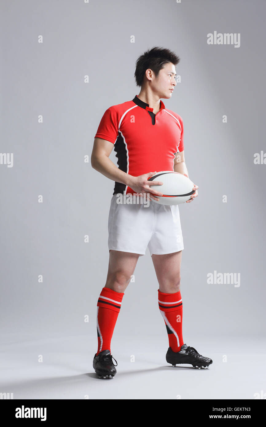 Portrait of Japanese rugby player with ball Stock Photo - Alamy
