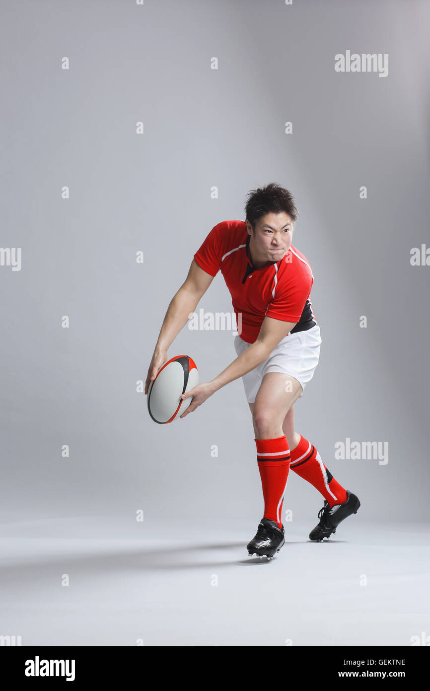 Portrait of Japanese rugby player throwing ball Stock Photo - Alamy