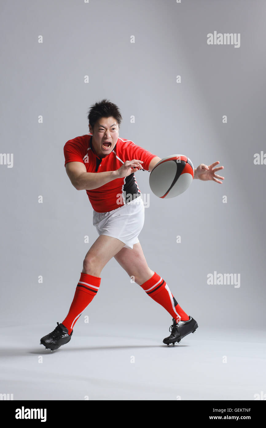 Portrait of Japanese rugby player throwing ball Stock Photo - Alamy