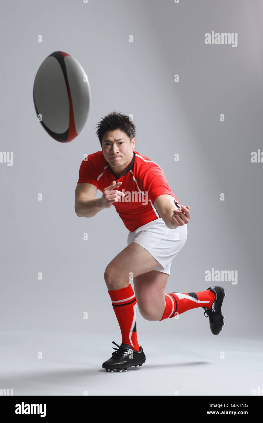 Portrait of Japanese rugby player throwing ball Stock Photo - Alamy