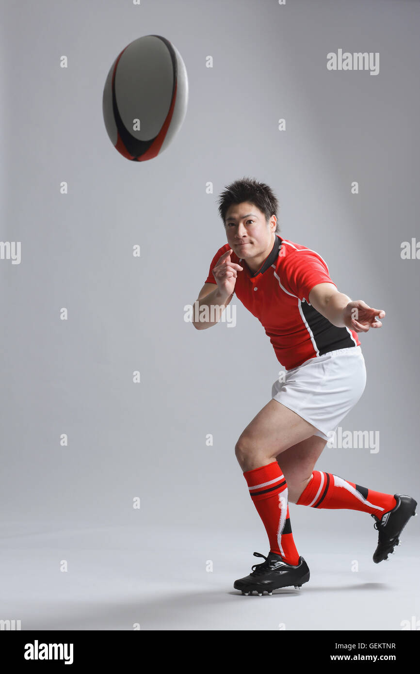 Portrait of Japanese rugby player throwing ball Stock Photo - Alamy