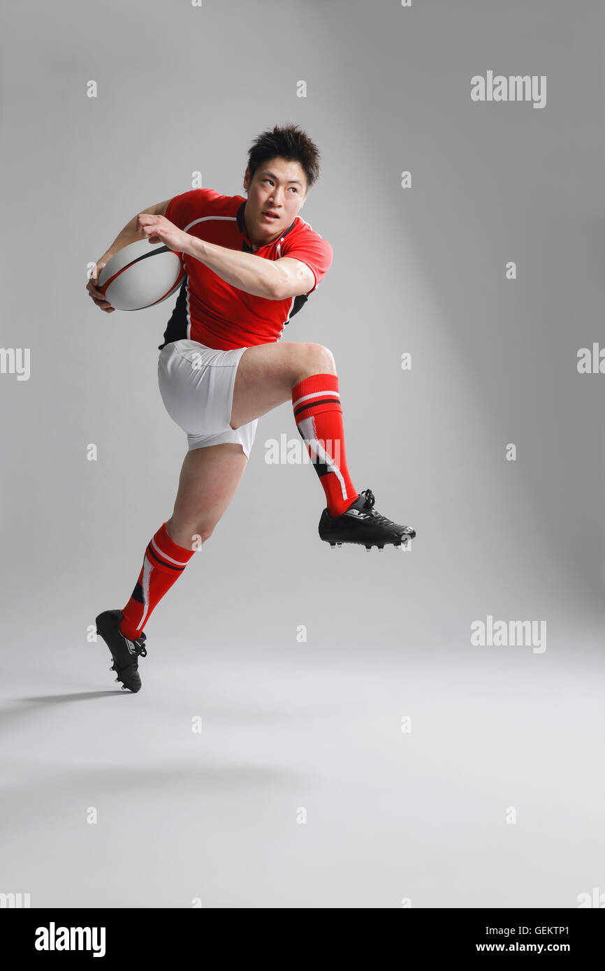 Rugby player running ball hi-res stock photography and images - Alamy