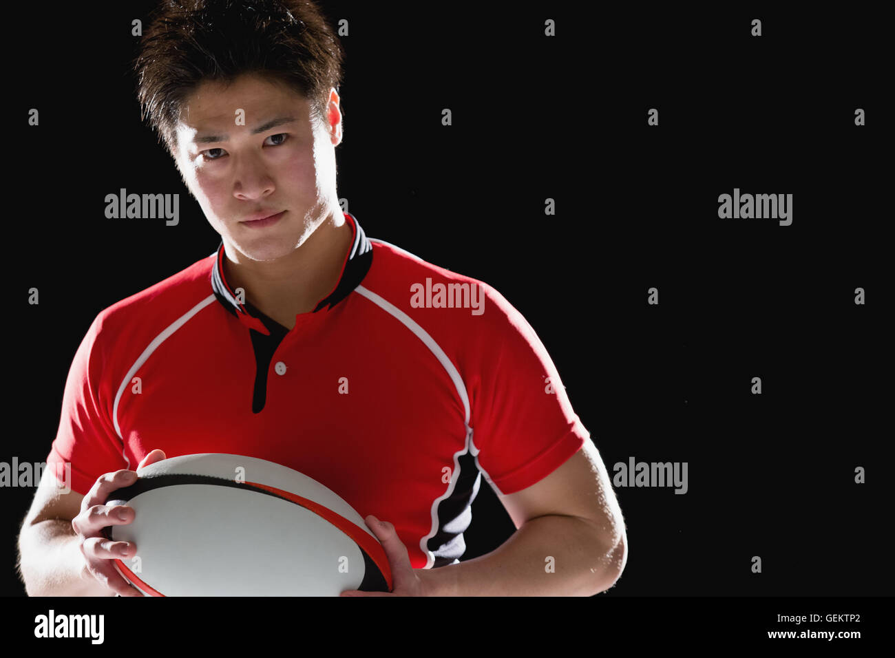 Portrait of Japanese rugby player with ball Stock Photo - Alamy