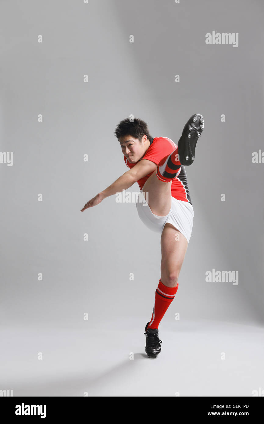 Portrait of Japanese rugby player kicking Stock Photo - Alamy