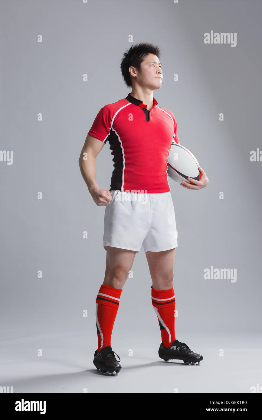 Portrait of Japanese rugby player with ball Stock Photo - Alamy