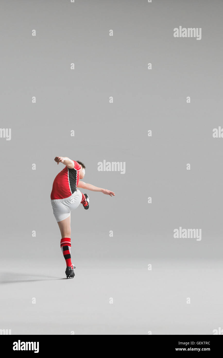 Portrait of Japanese rugby player kicking Stock Photo - Alamy