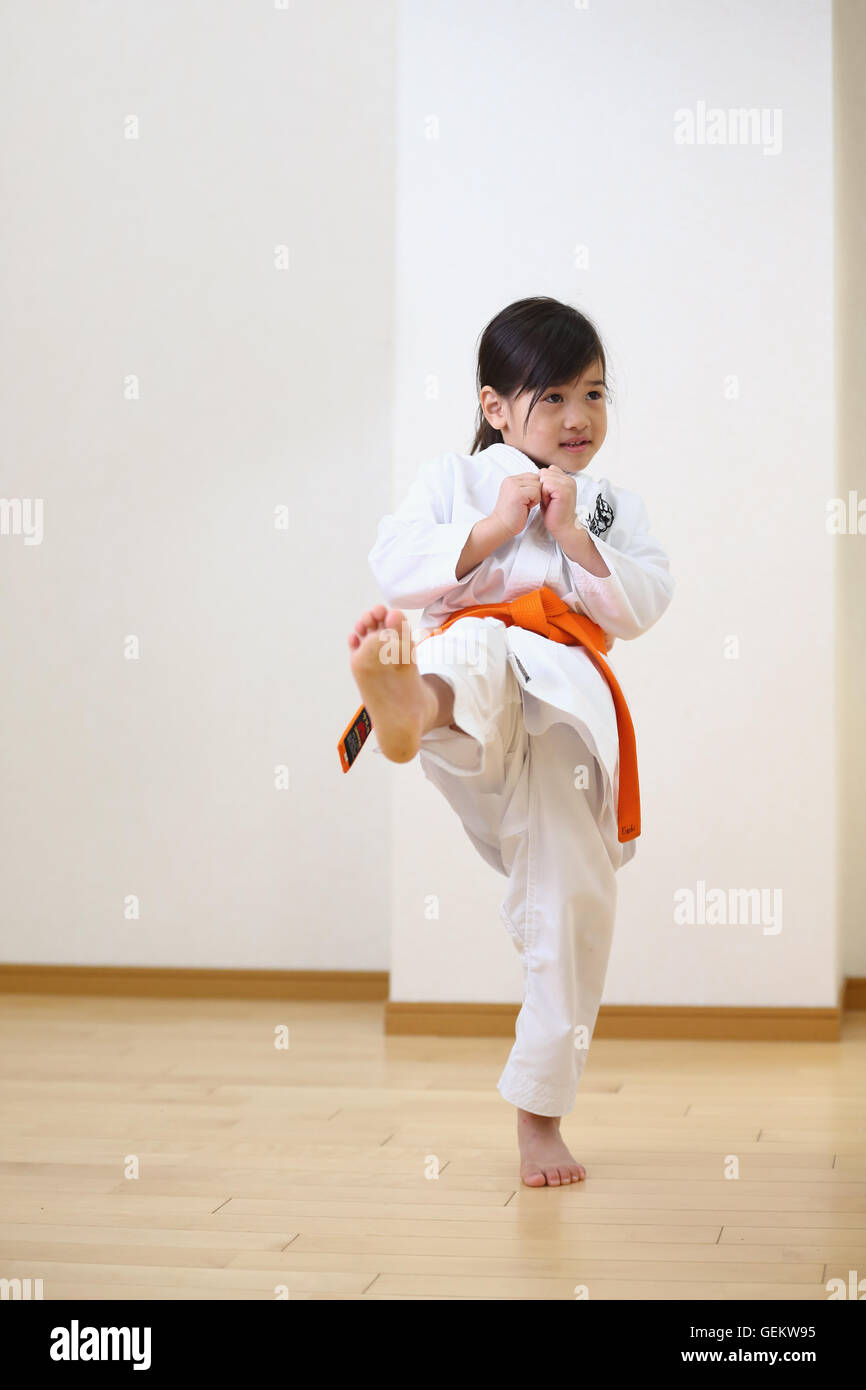Japanese kid in karate uniform training Stock Photo - Alamy