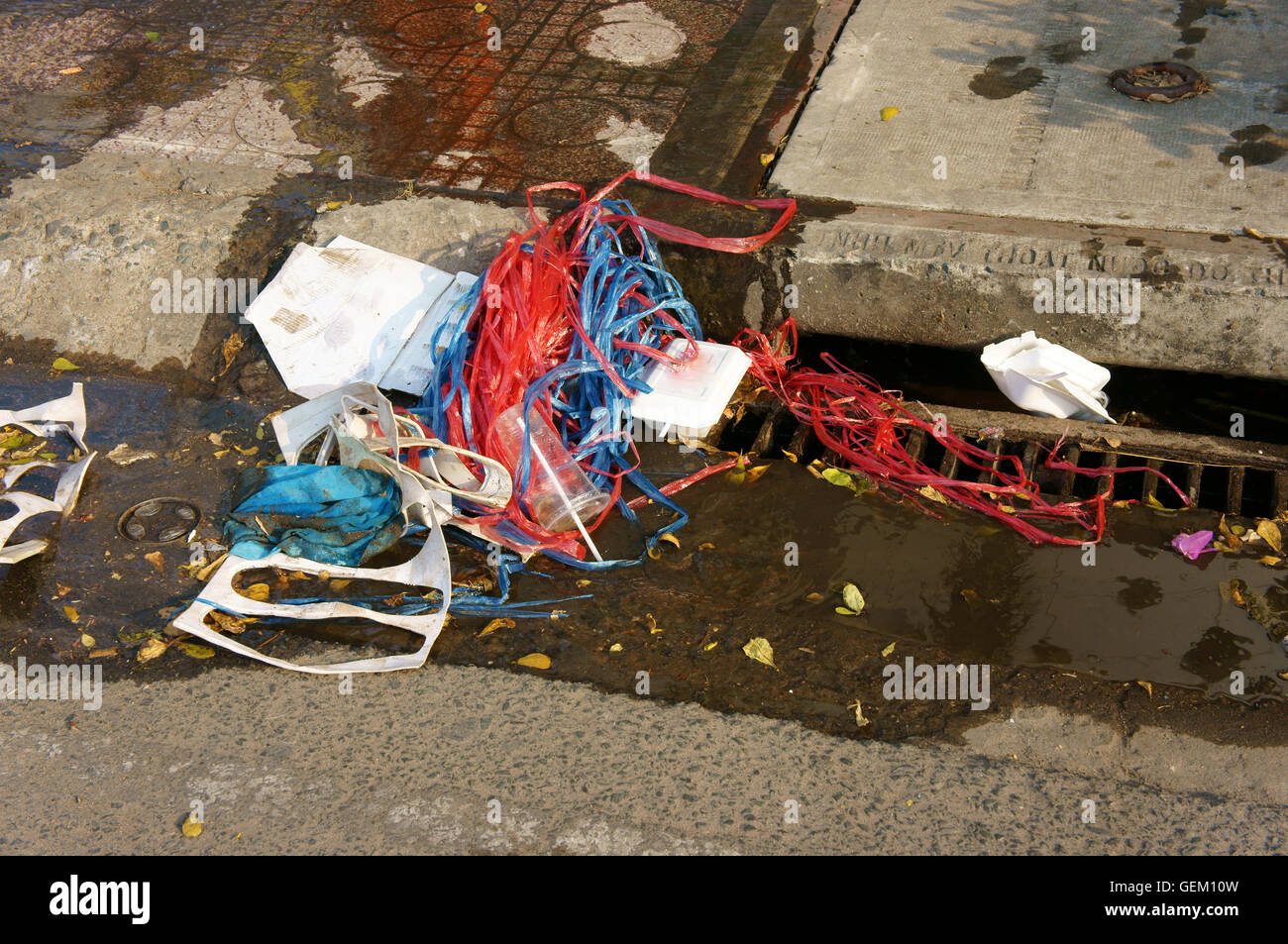 Waste at manhole on street of city, the environment problem at ...