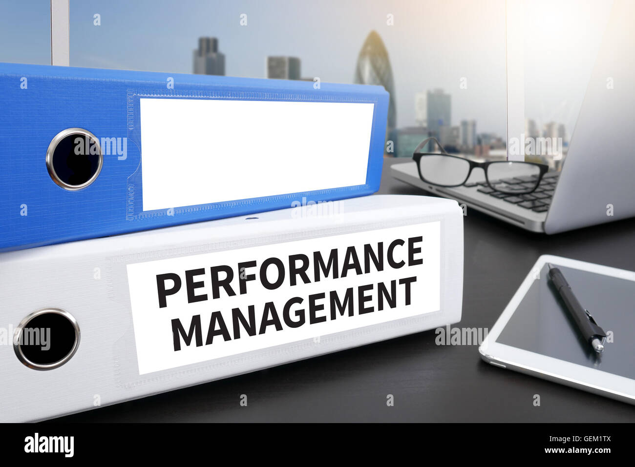 PERFORMANCE MANAGEMENT Office folder on Desktop on table with Office ...