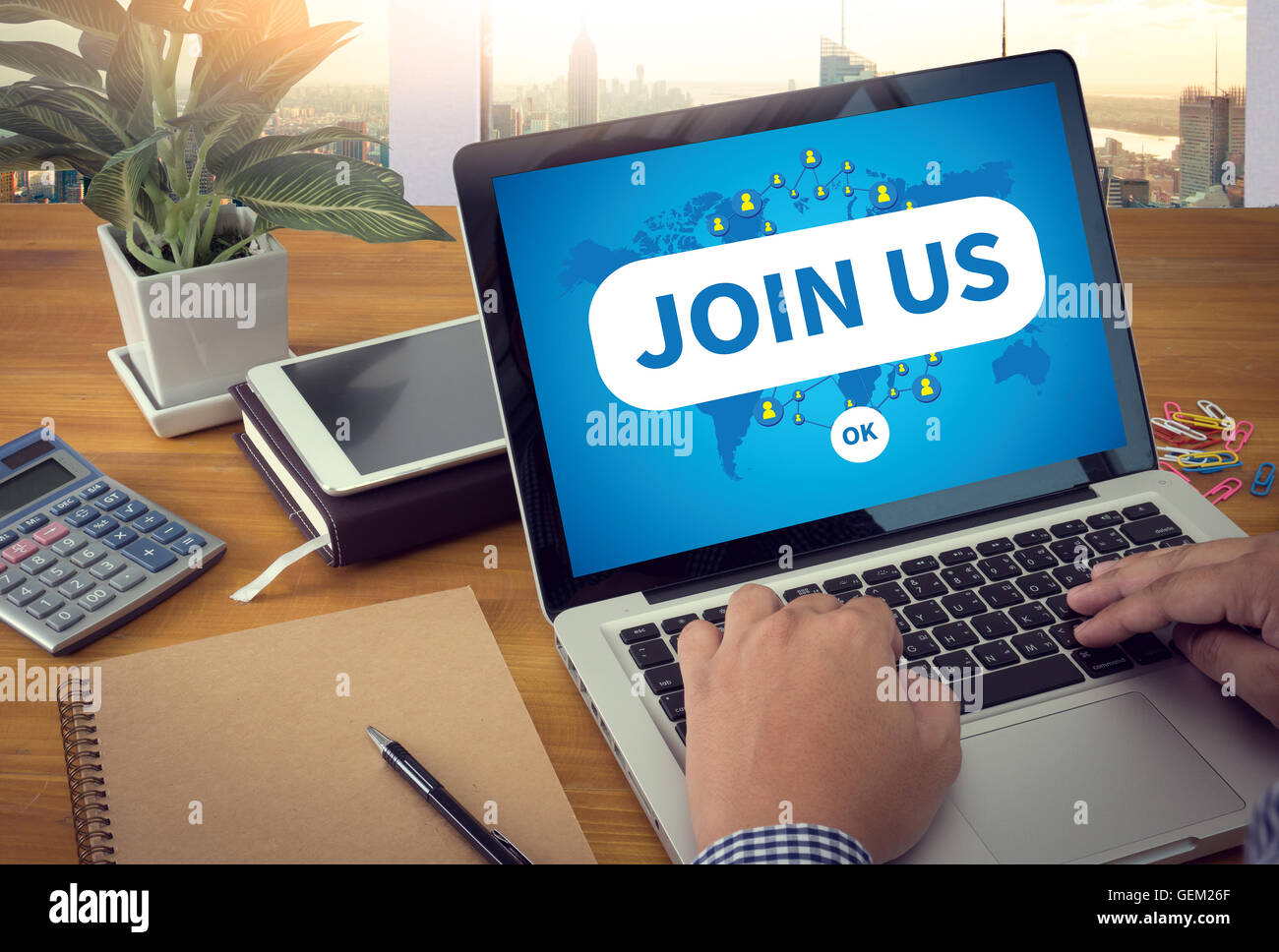 JOIN US Close up of business man hand working laptop computer on wooden ...