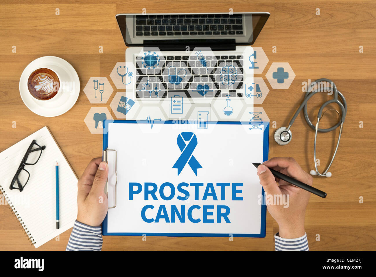 PROSTATE CANCER Top view, Doctor writing medical records on a clipboard ...